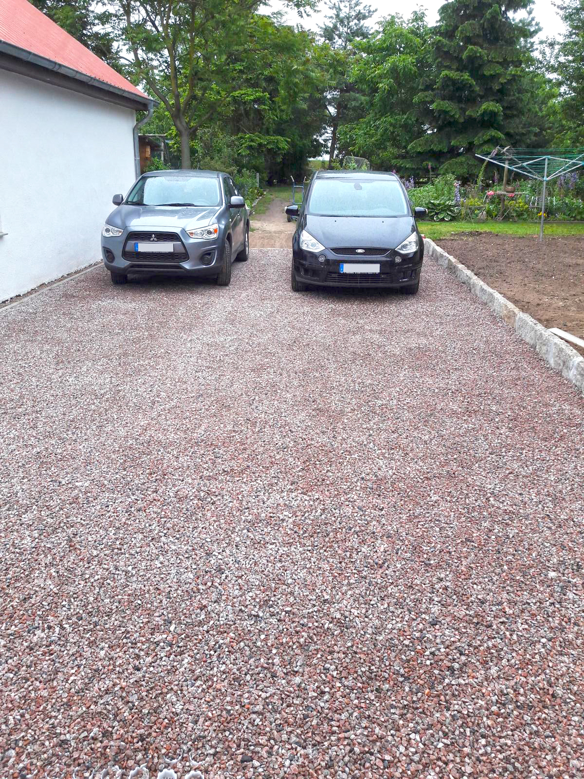 Car parking space on stabilized gravel surface using gravel grid KG30 ...